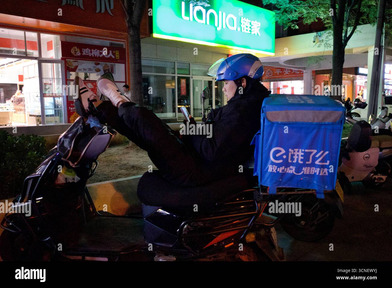 Beijing daily life A general view showing the a Ele.me delivery driver ...