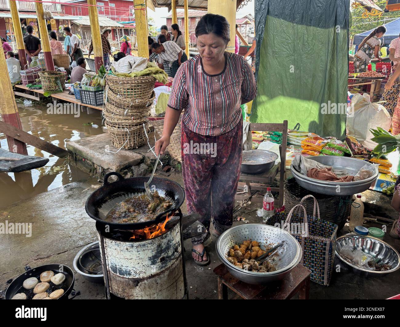 A woman prepares foods for customers at a local bazaar Sunday, Sept. 21 ...
