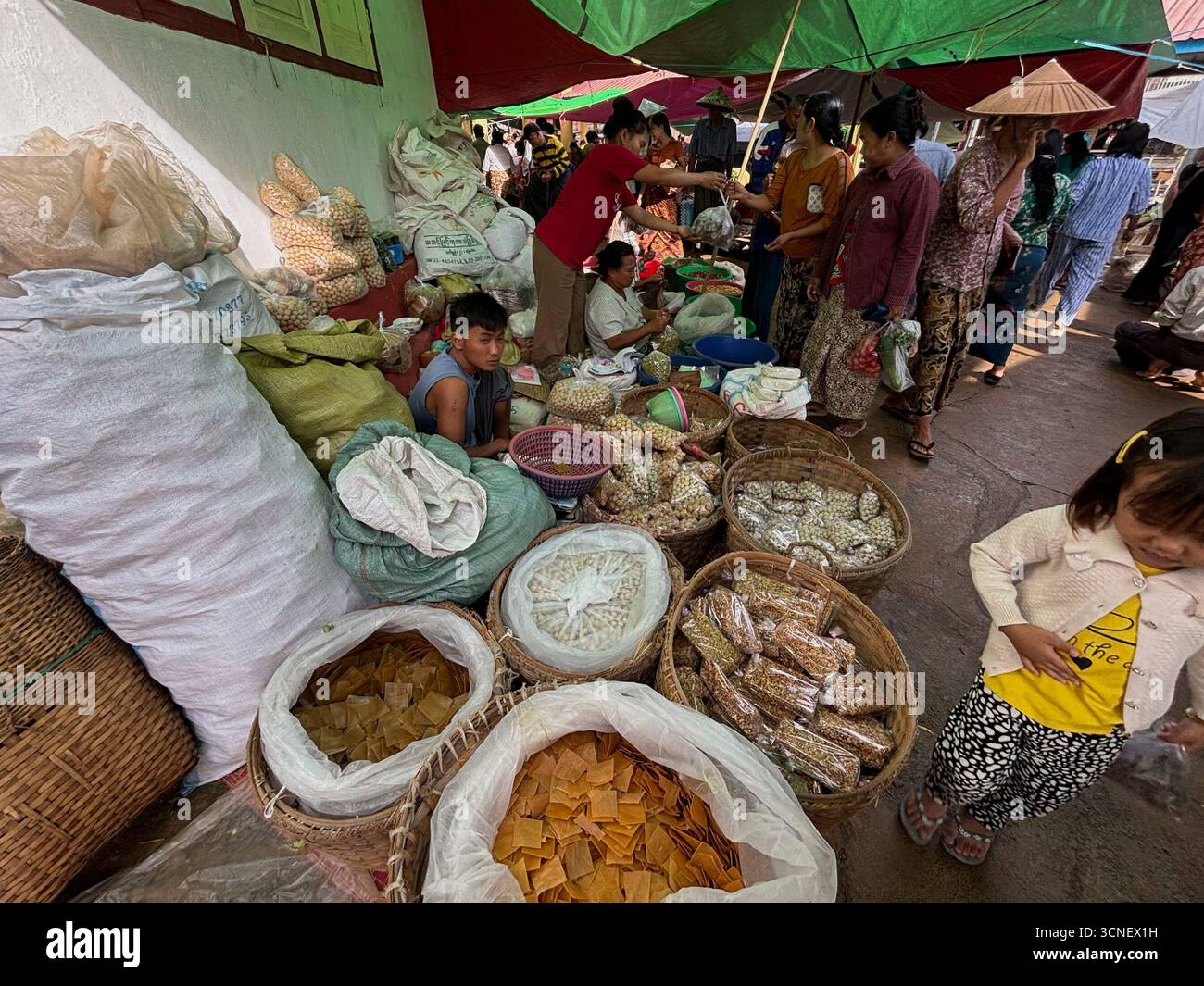 Vendors selling snacks wait for customers at a local bazaar Sunday ...