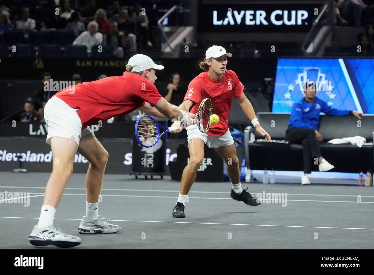 Team World's Alex Michelsen, of the United States, left, returns a shot ...