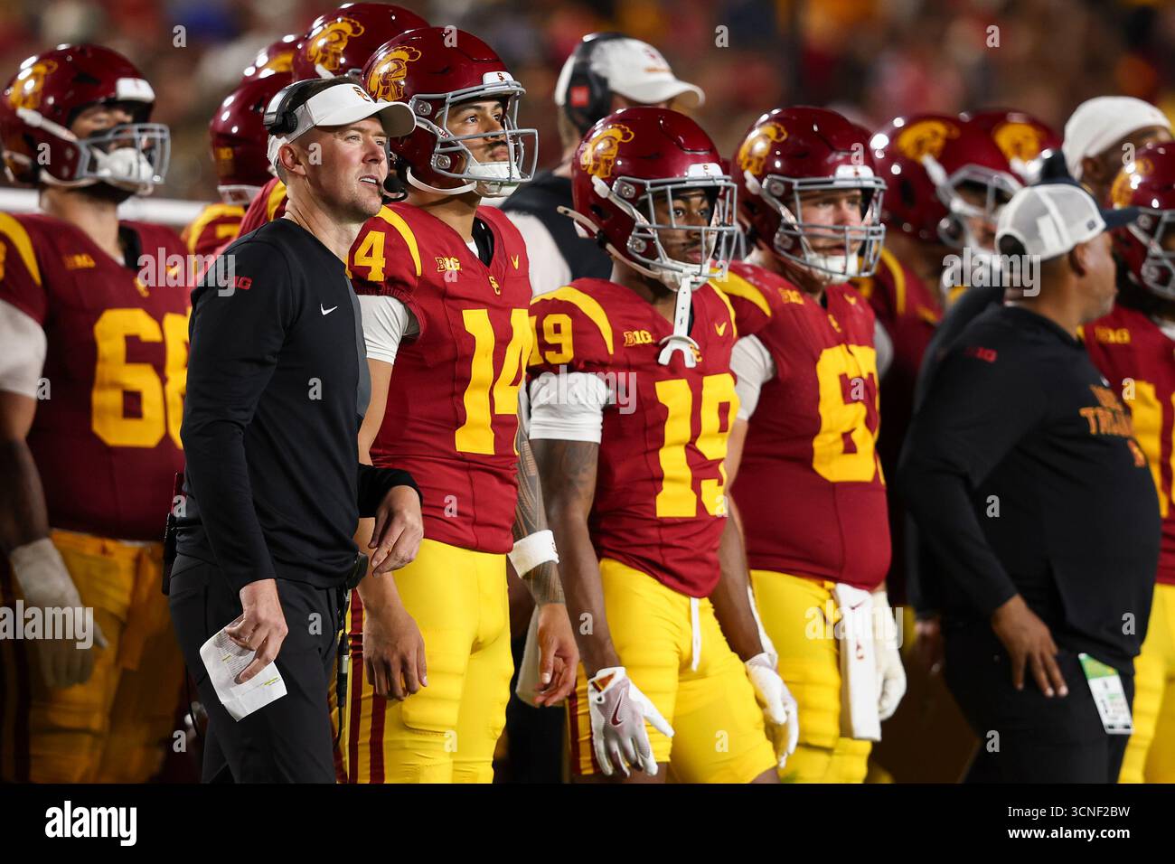 Southern California head coach Lincoln Riley, left, looks on alongside ...