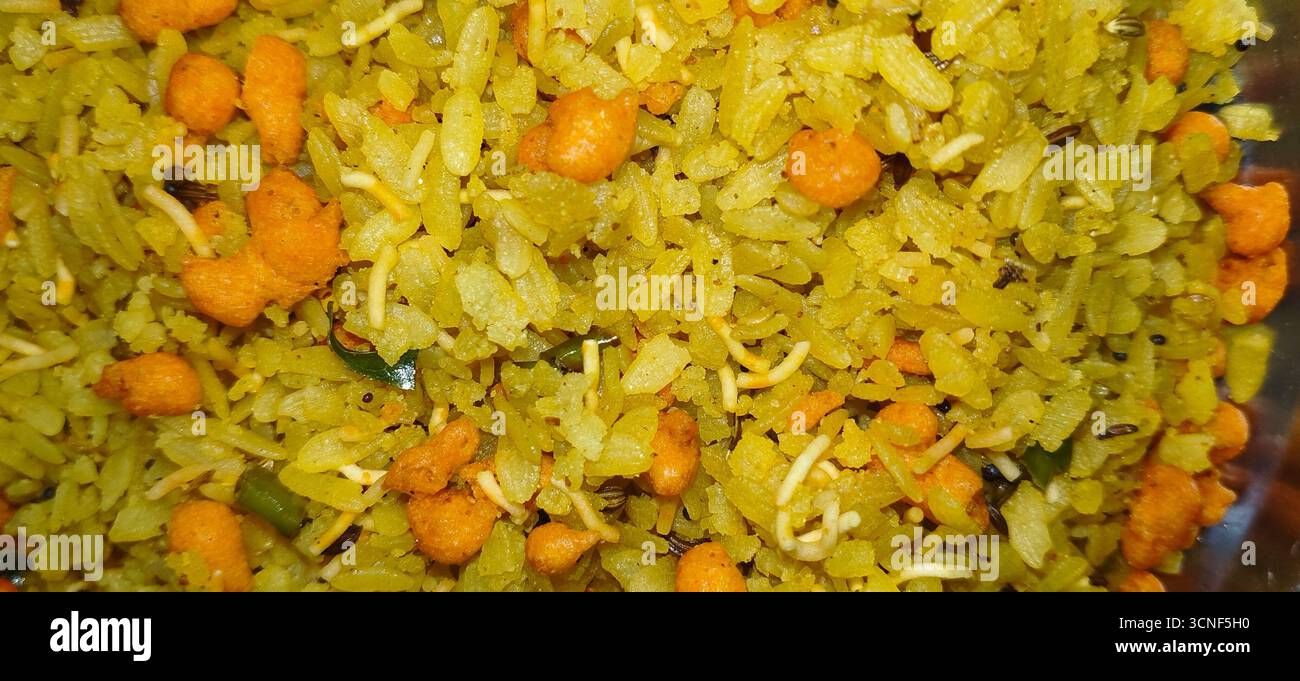 indian breakfast dish poha.Indian breakfast Poha topped with peanuts ...