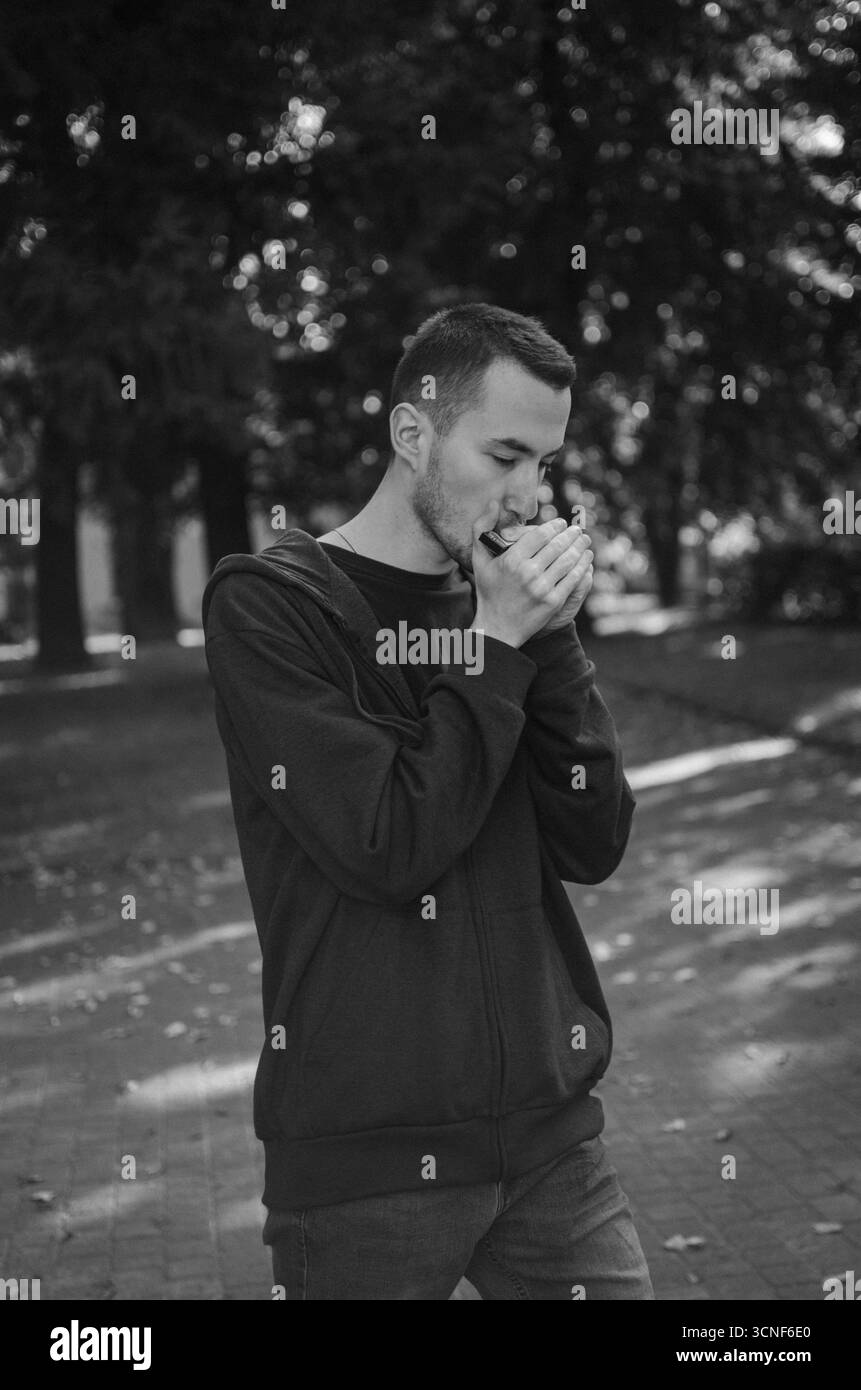 Young man youth playing Black and White Stock Photos & Images - Alamy