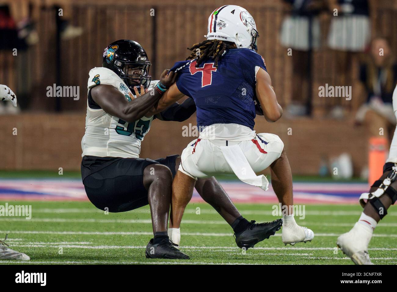 Coastal Carolina offensive lineman Gavin McLaughlin (55) sacks South ...