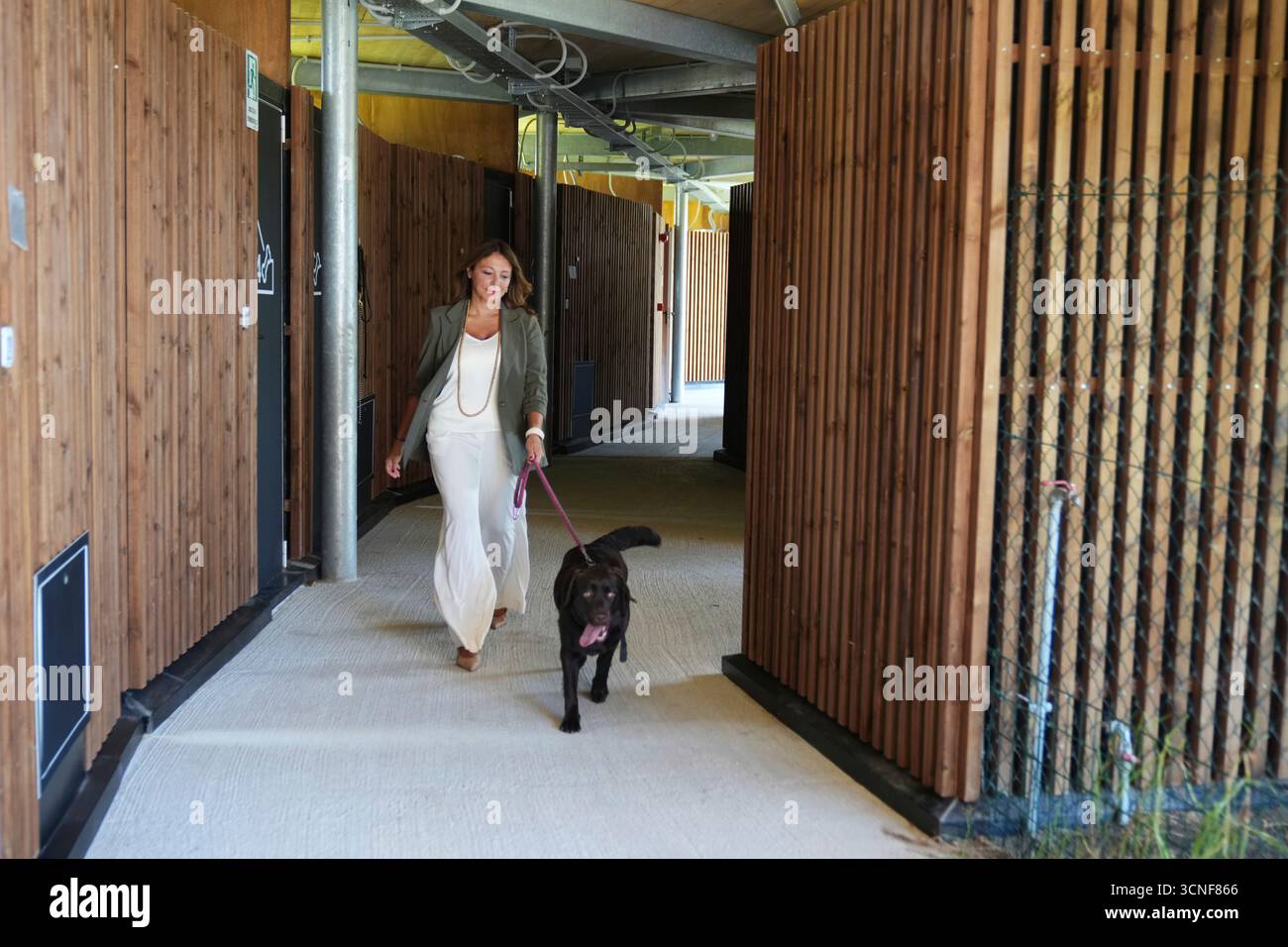 Alessandra Morelli arrives with Nina, a Labrador Retriever at the Dog ...
