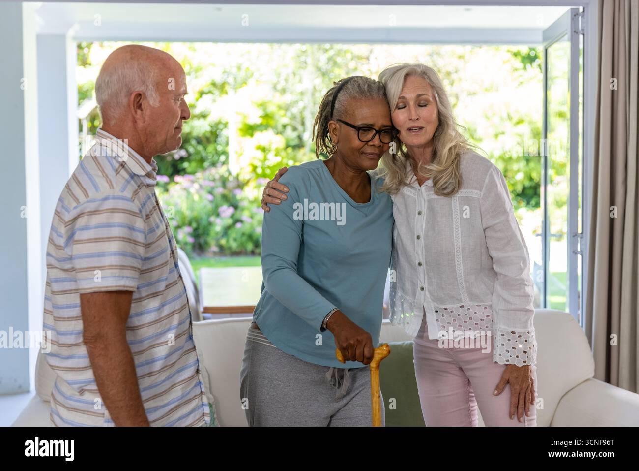 Diverse friends leaning senior woman hi-res stock photography and ...