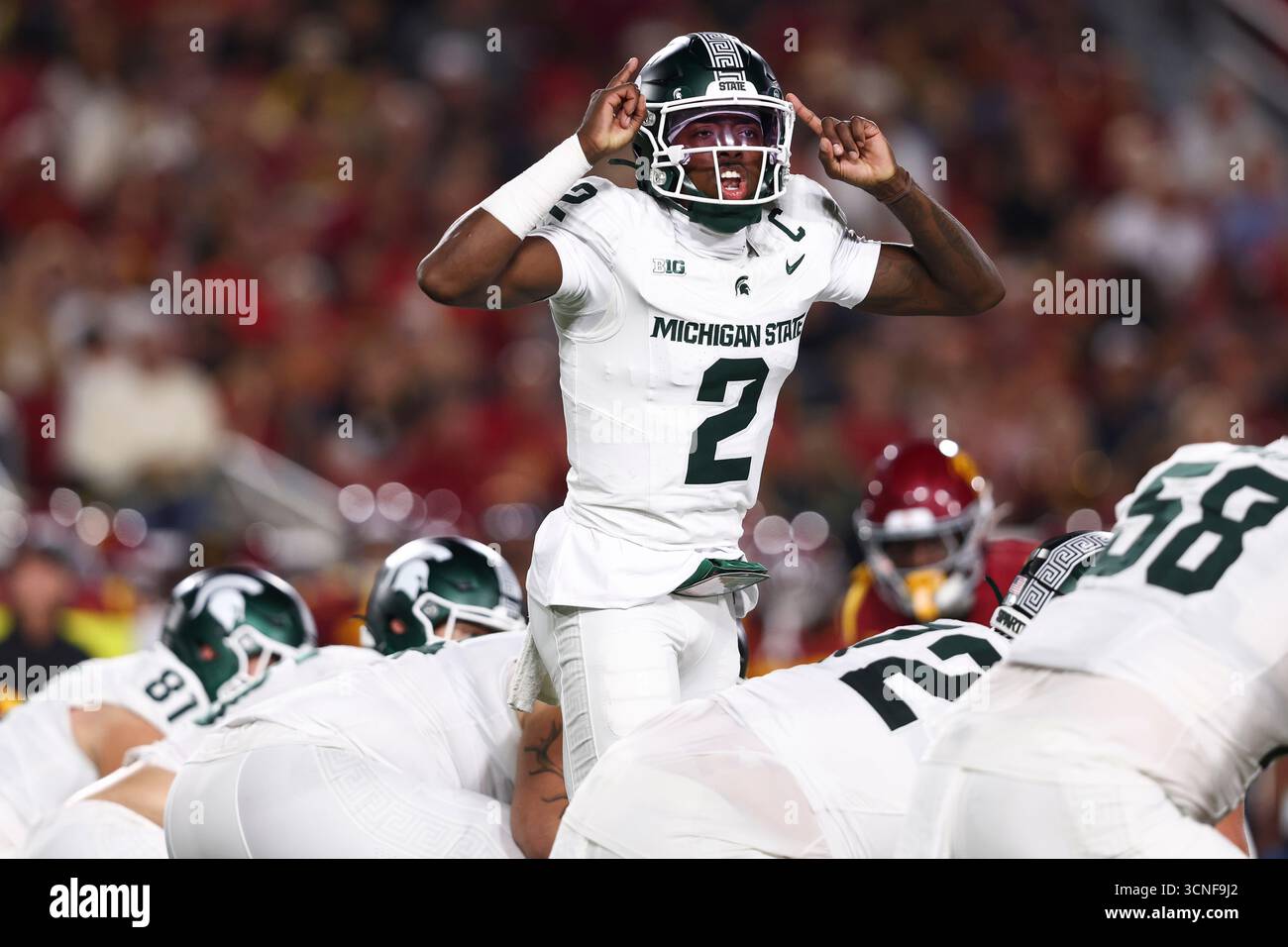 Michigan State quarterback Aidan Chiles (2) gestures during the first ...
