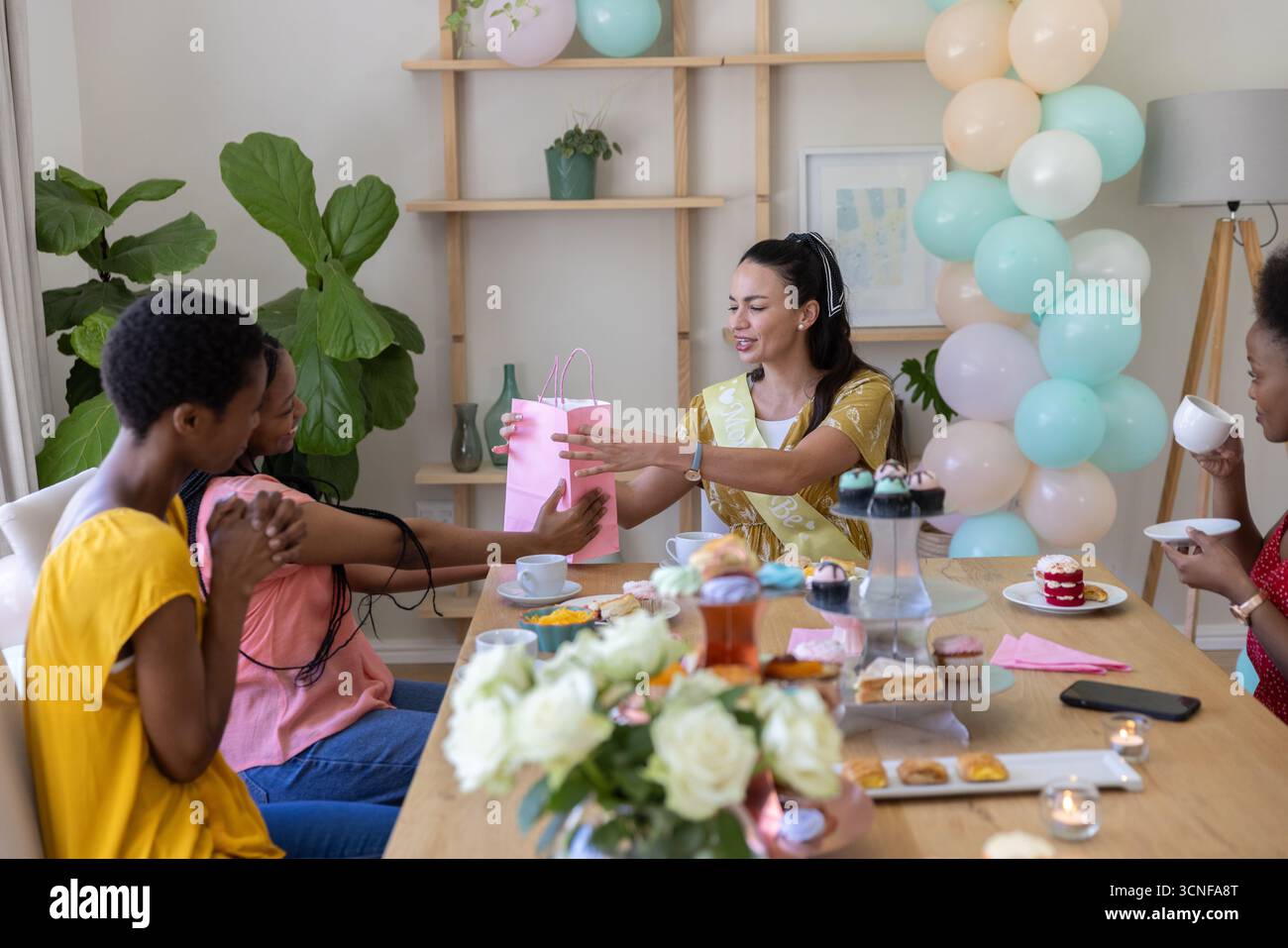 Handing woman wearing pink hi-res stock photography and images - Alamy