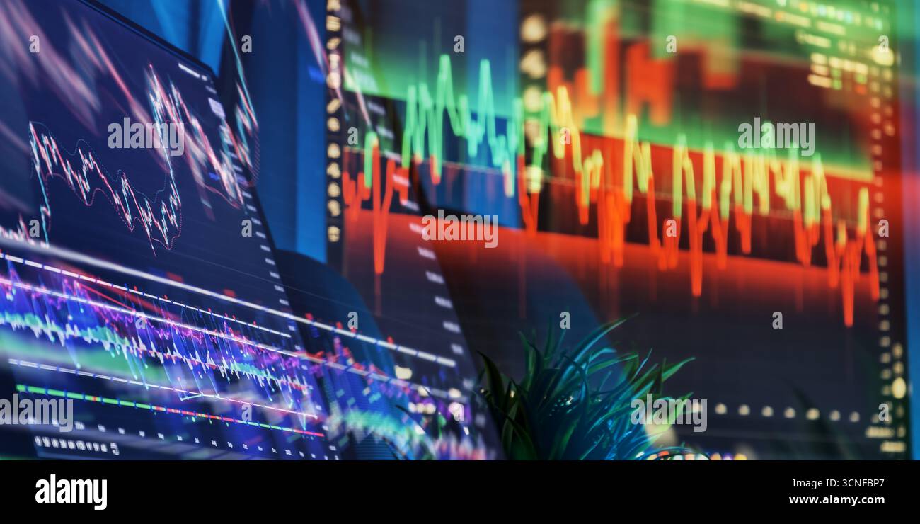 Colorful trading setup with multiple screens displaying candlestick ...