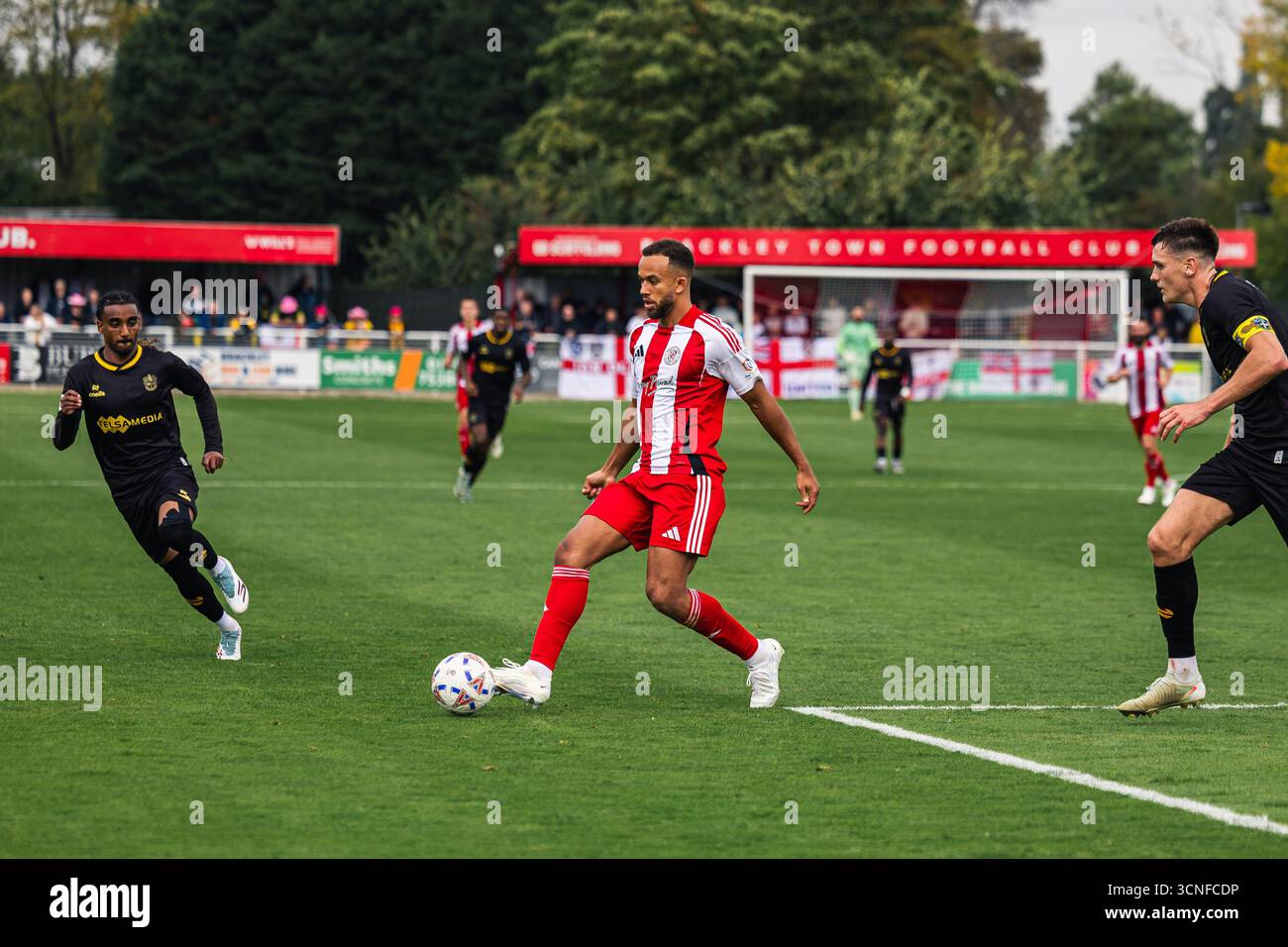 Brackley, UK. 20th Sep, 2025. Danny Waldron (14 Brackley Town) passes ...