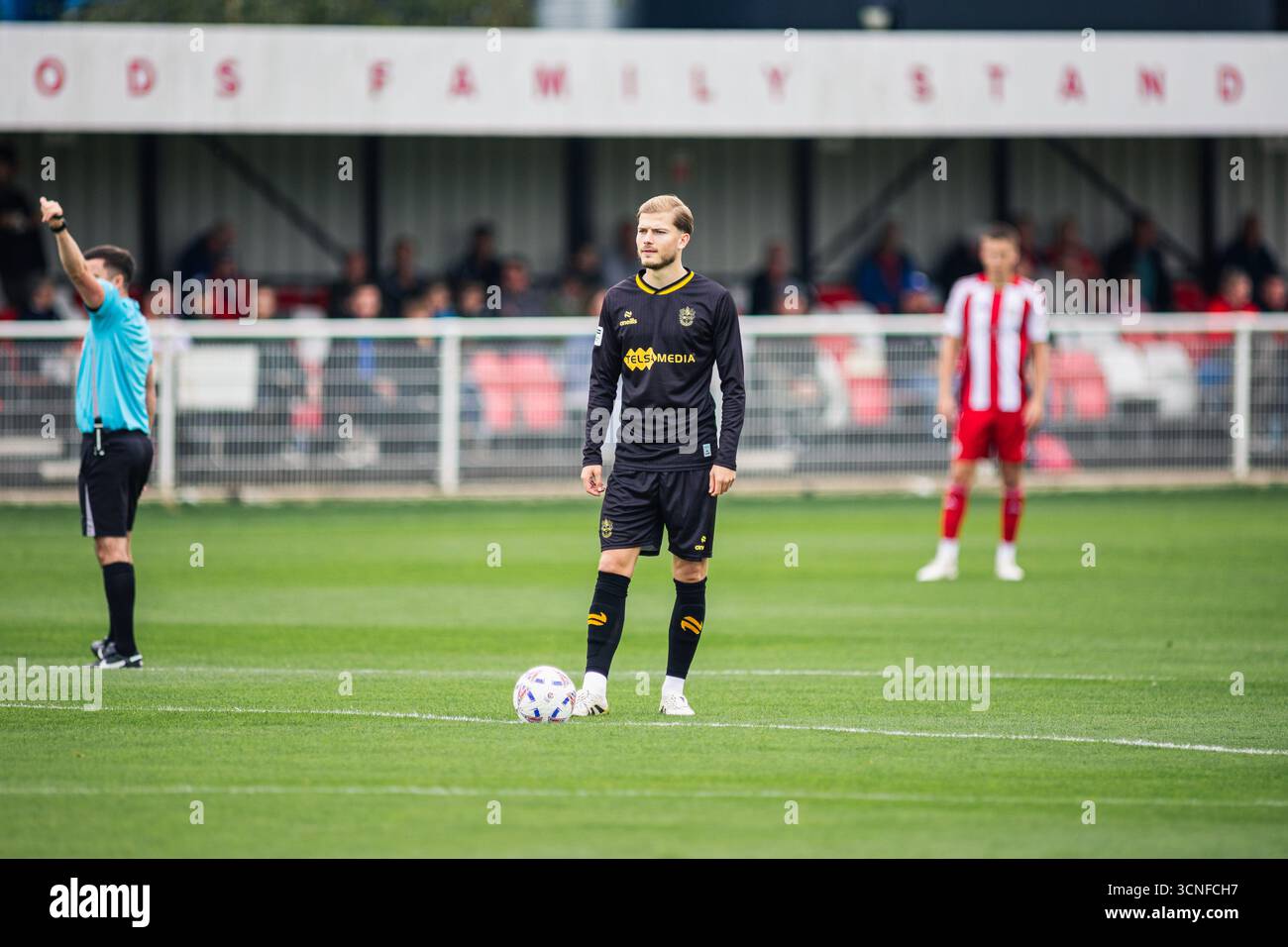 Brackley, UK. 20th Sep, 2025. Lewis Simper (8 Sutton United) looks on ...