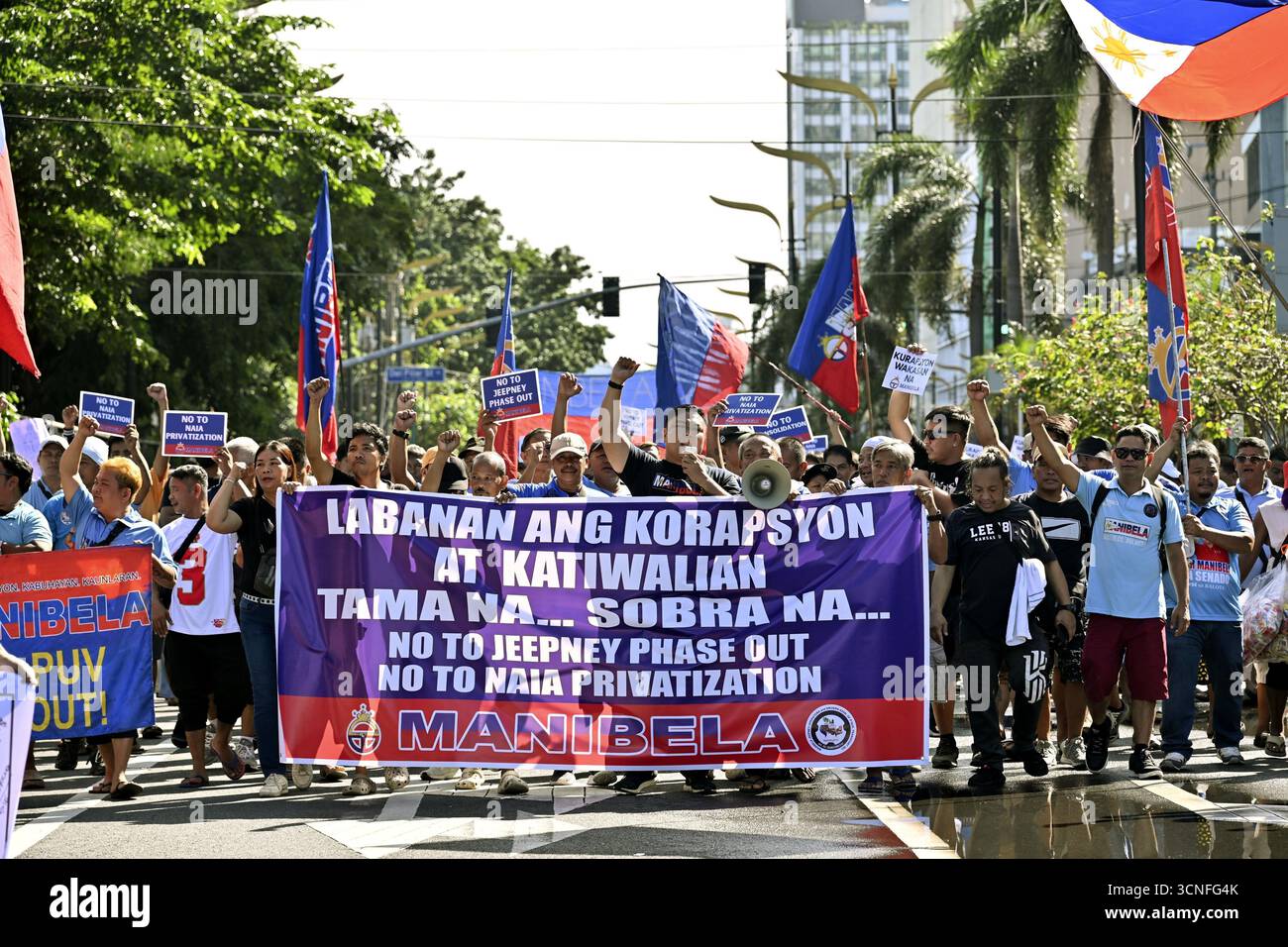 People stage an anti-government rally in the Philippine capital Manila ...