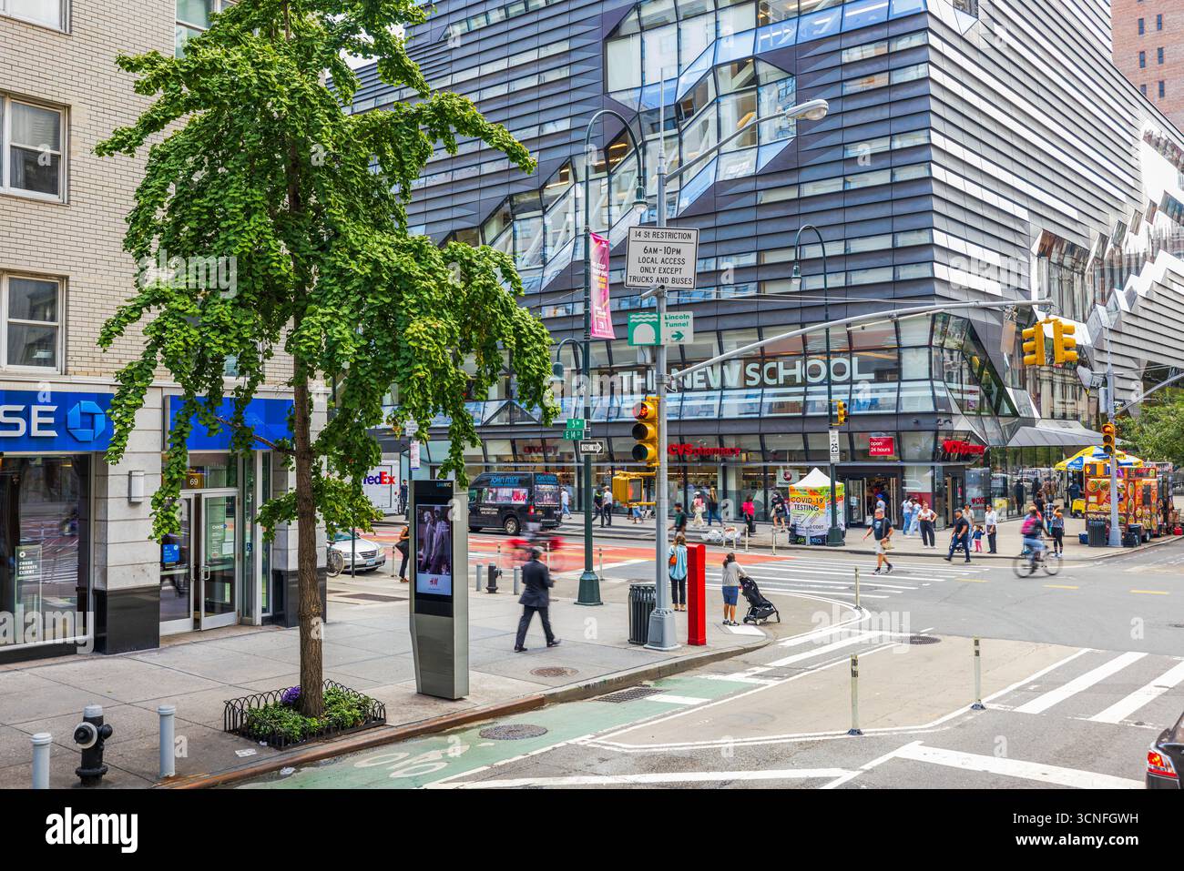 Busy New York City street view with The New School modern building ...