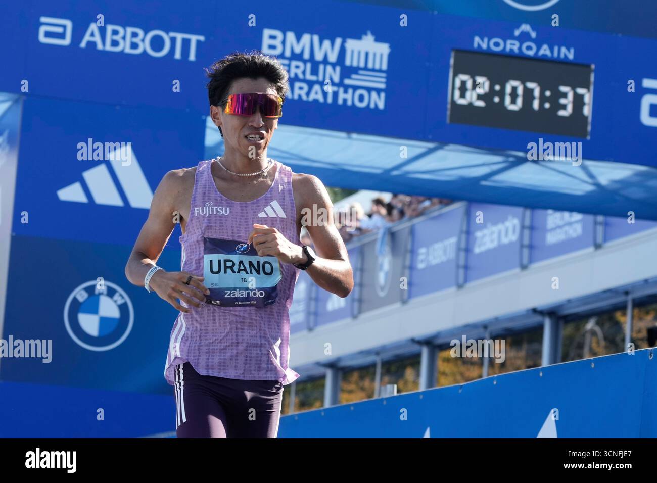 Japan's Yuhei Urano crosses the finish in the Berlin Marathon in Berlin, Germany, Sunday, Sept ...