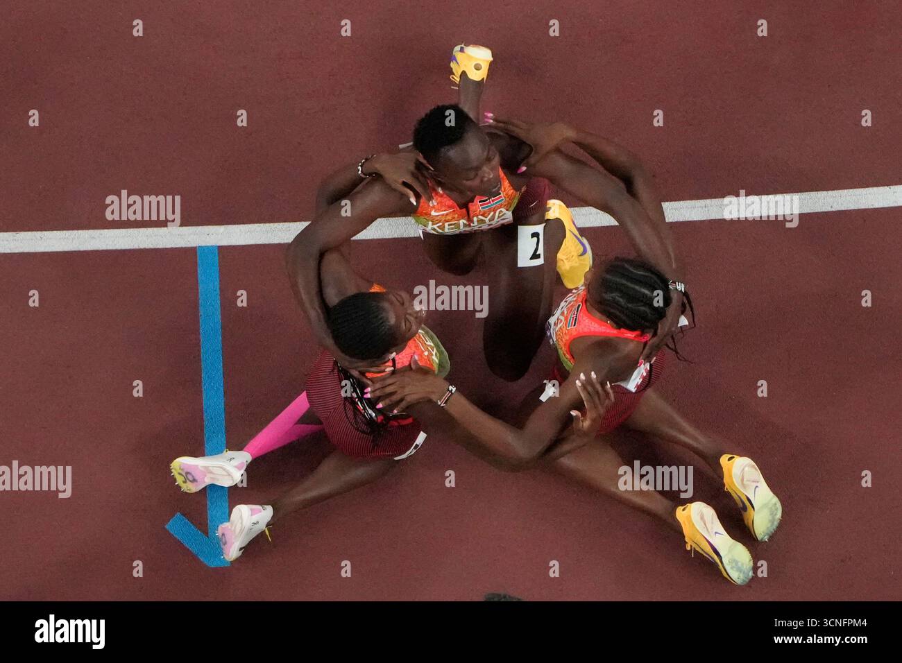 Kenya's Lilian Odira, right, celebrates with Mary Moraa and Kenya's ...