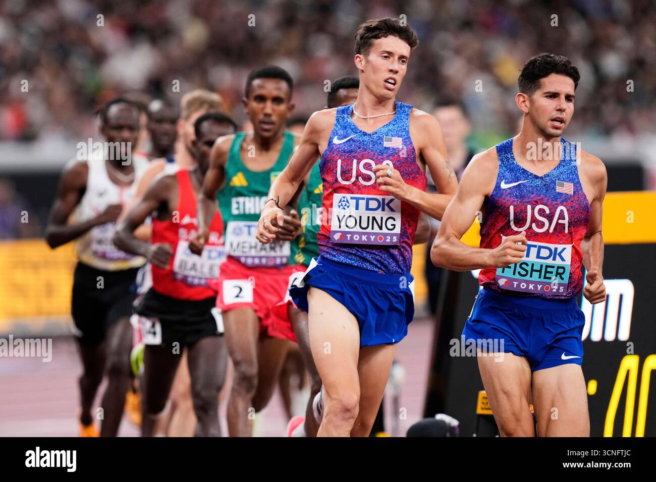 United States' Nico Young and Grant Fisher compete in the men's 5,000 ...