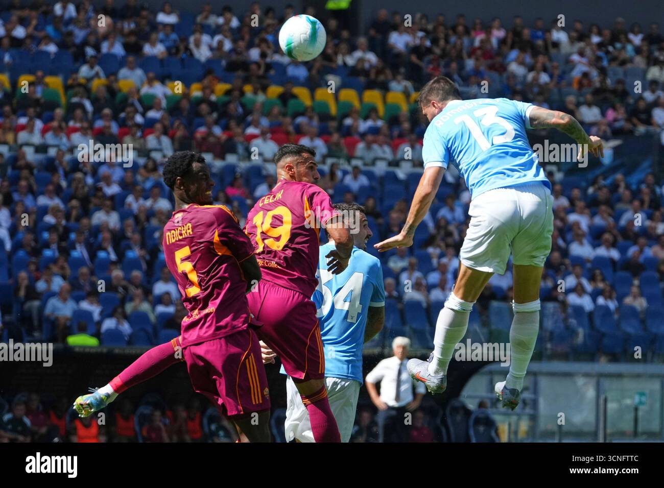 From left, Roma's Evan Ndicka, Roma's Zeki Celik, Lazio's Alessio ...