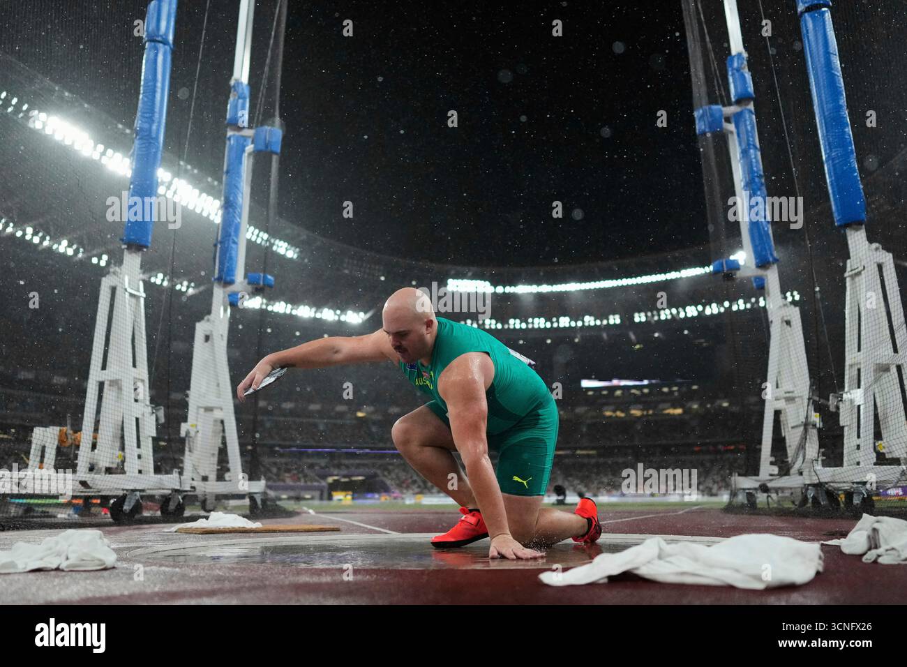 Australia's Matthew Denny slips during the men's discus throw final at ...