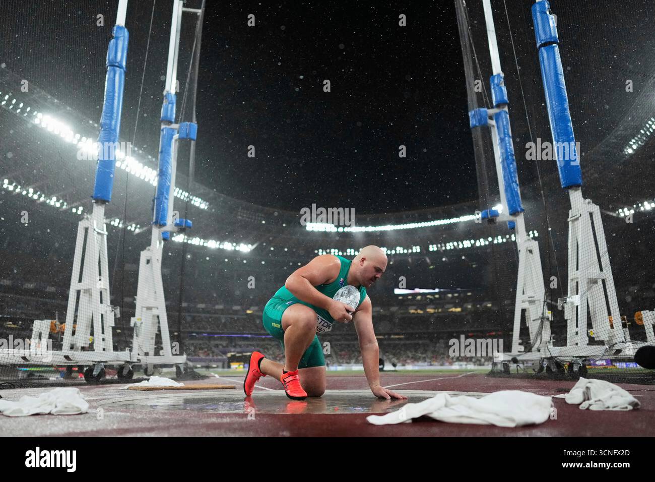 Australia's Matthew Denny slips during the men's discus throw final at ...