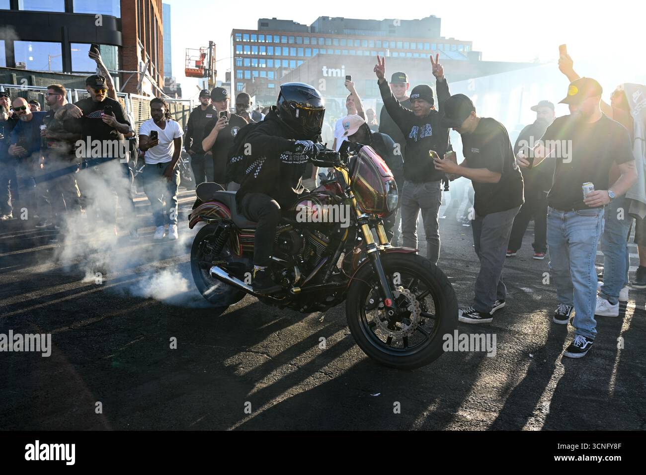 People ride motorcycles during the 22nd Annual Indian Larry Block Party ...