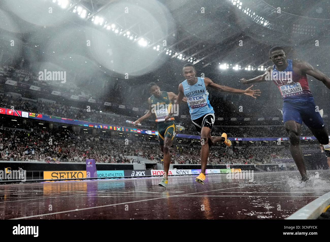 Botswana's Busang Collen Kebinatshipi, center, wins the the men's 4 X ...
