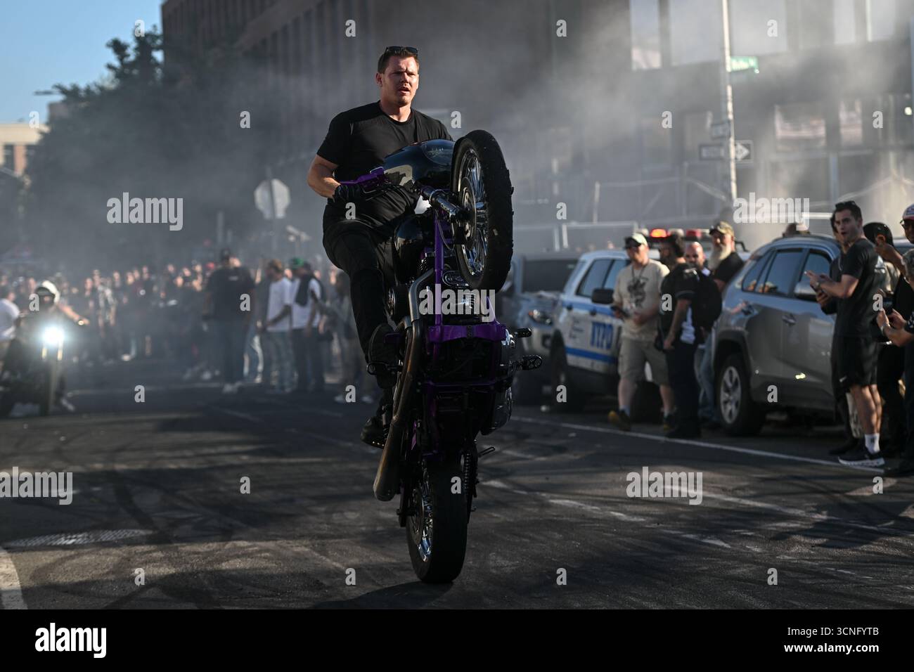 People ride motorcycles during the 22nd Annual Indian Larry Block Party ...