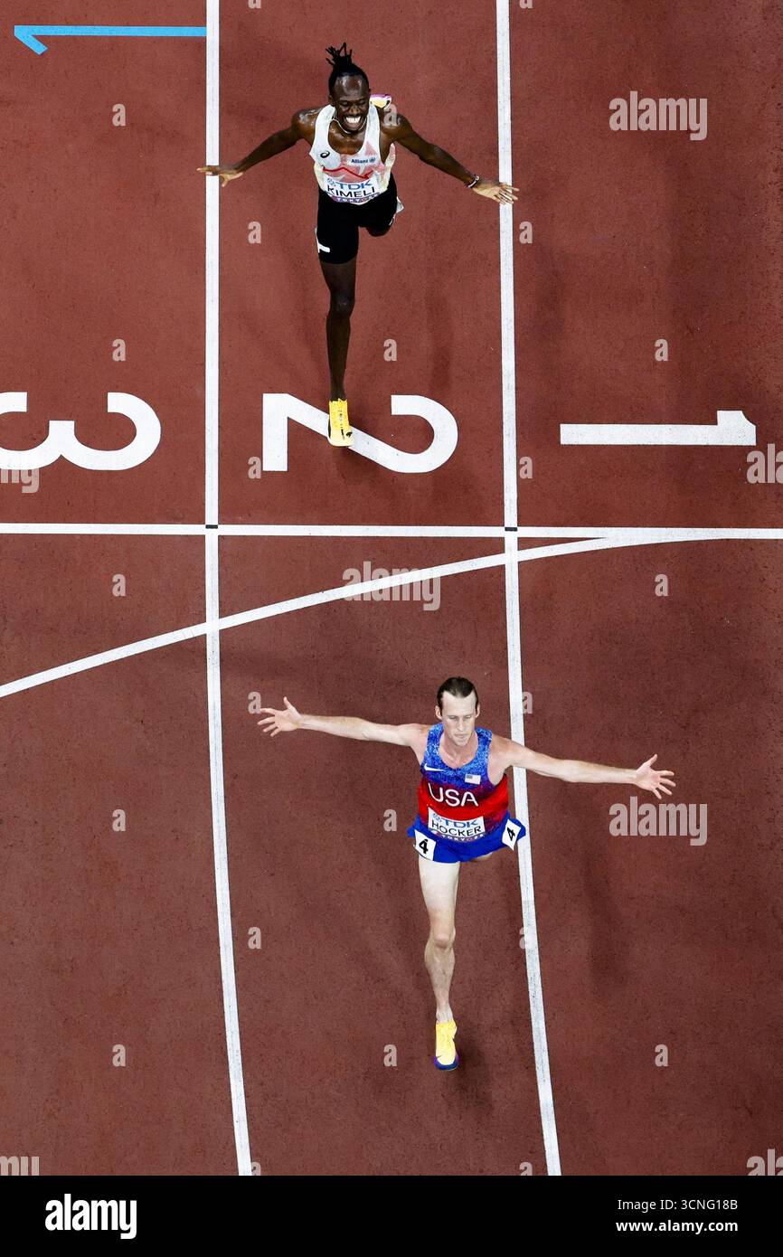 Cole Hocker (bottom) of the United States wins the men's 5,000-meter ...