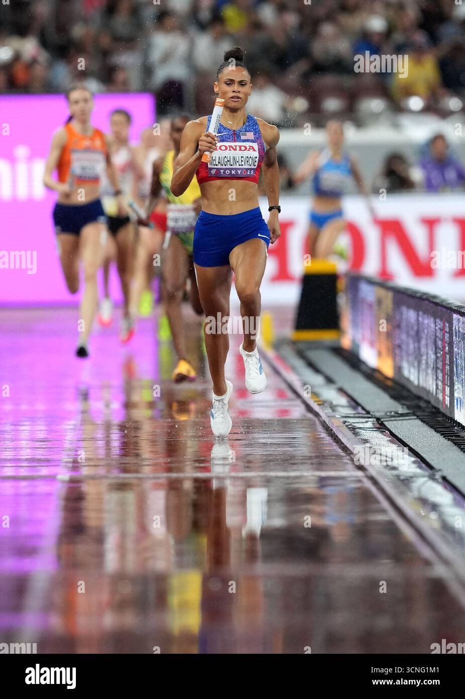 USA's Sydney McLaughlin-Levrone heads for the finish line to win the ...