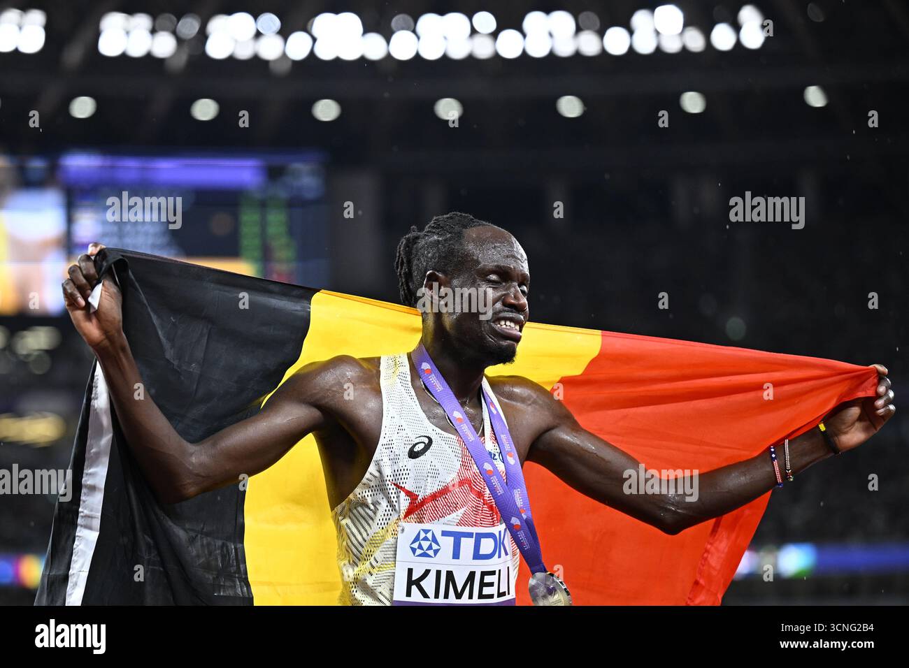 Belgian Isaac Kimeli celebrates after winning the silver medal in the ...