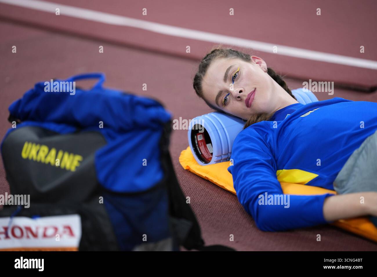 Yaroslava Mahuchikh of Ukraine lies down with her eyes closed during an ...