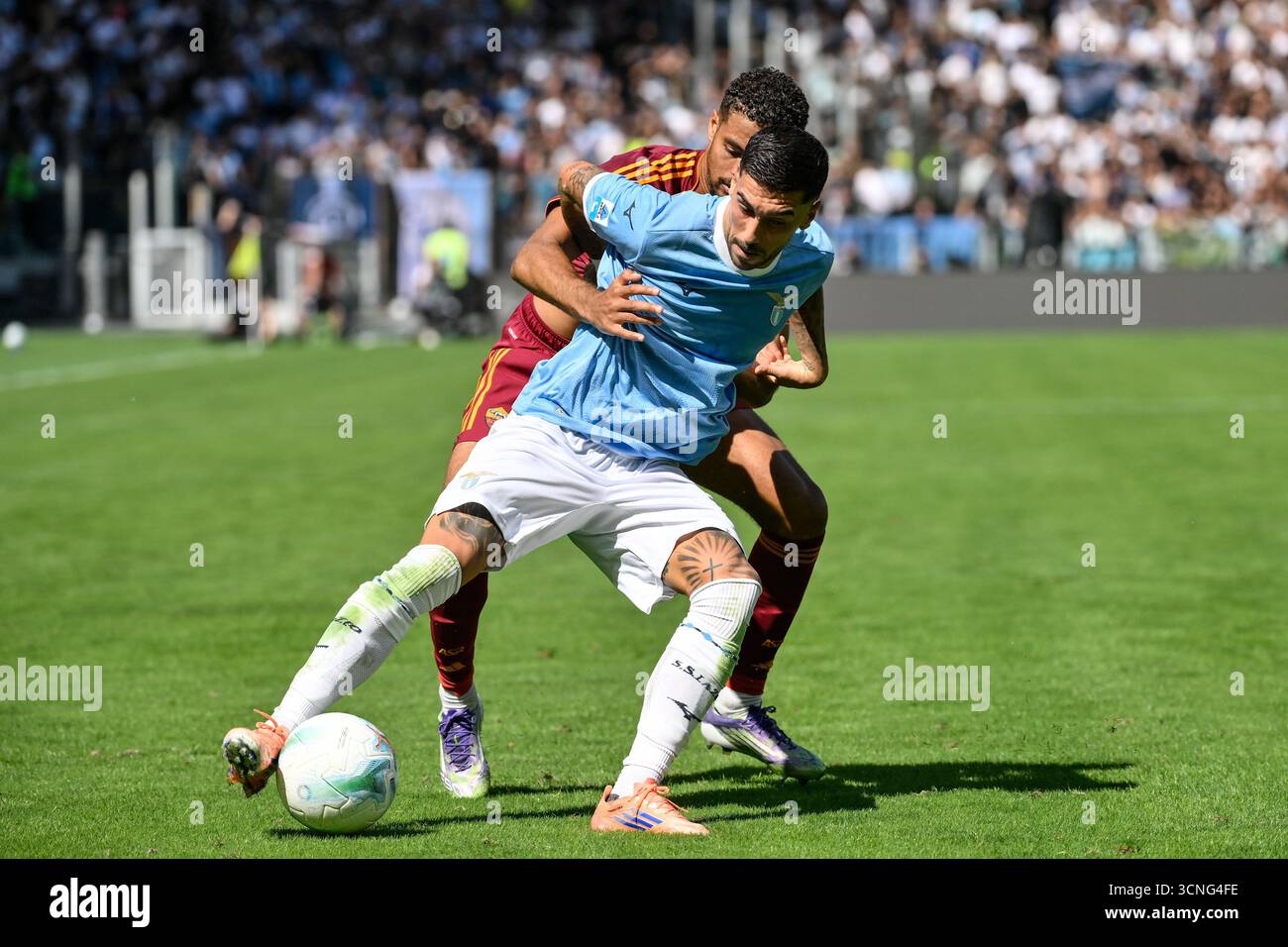 Devyne Rensch of AS Roma and Mattia Zaccagni of SS Lazio compete for ...