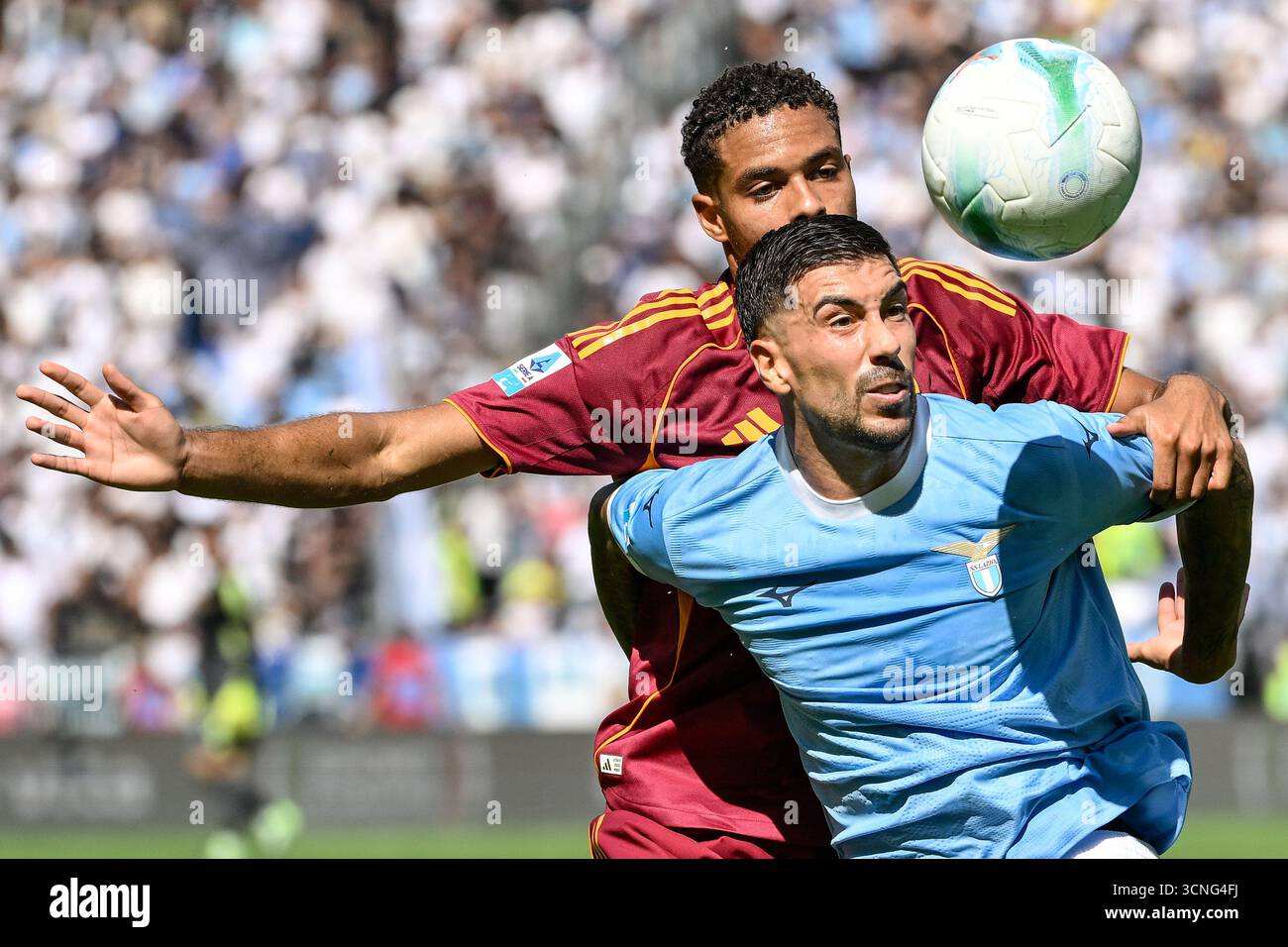 Devyne Rensch of AS Roma and Mattia Zaccagni of SS Lazio compete for ...