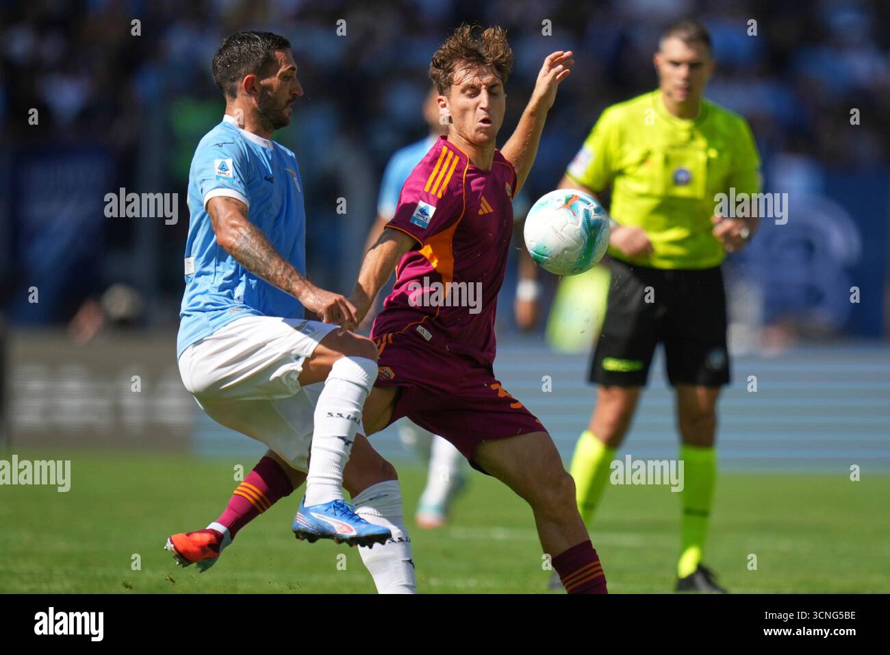 Lazio's Danilo Cataldi, left, challenges for the ball with Roma's ...