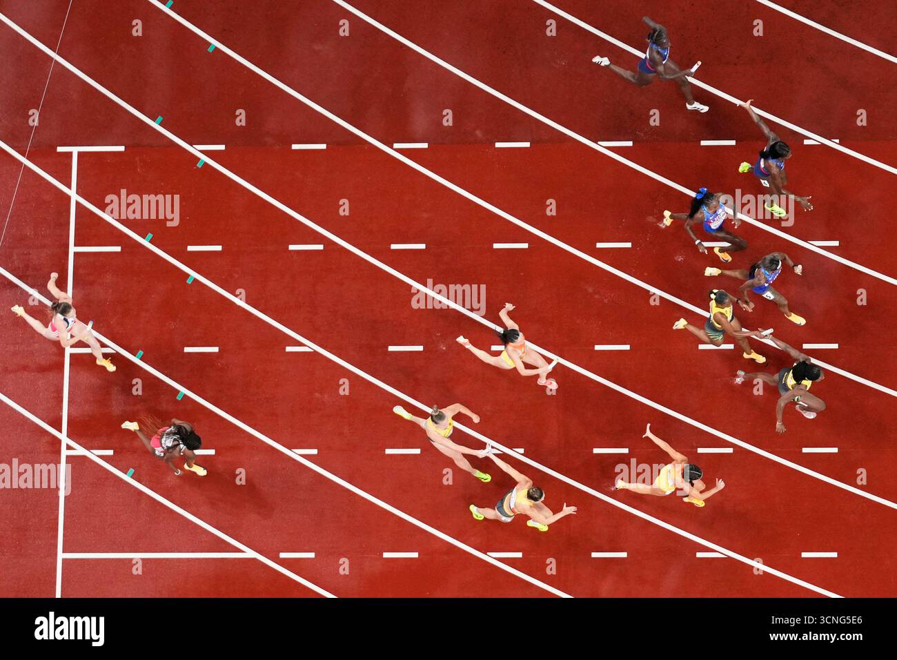 Athletes compete in the women's 4 X 100 meters relay final at the World ...