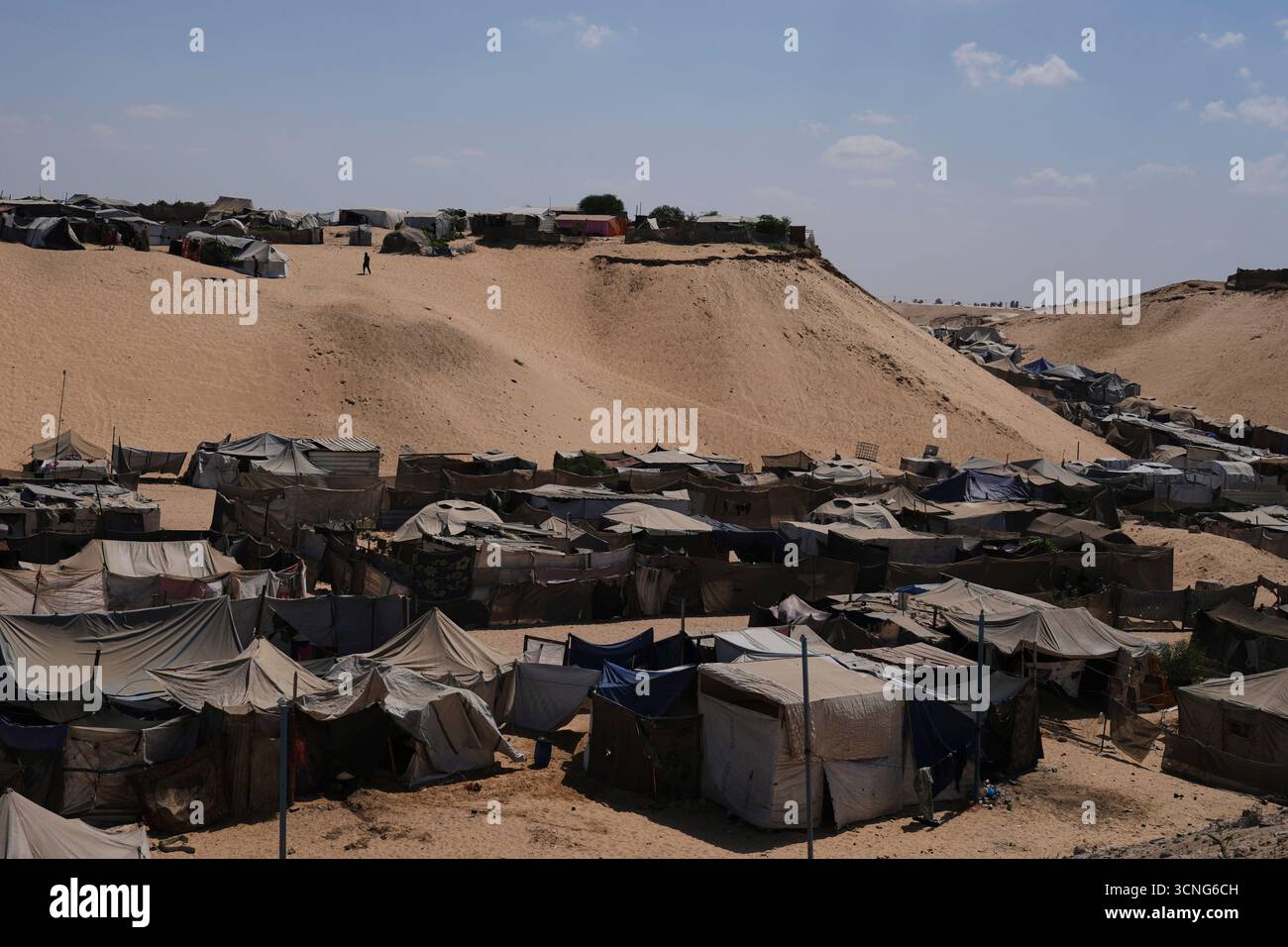 A tent camp for displaced Palestinians stretches along the Muwasi, an ...