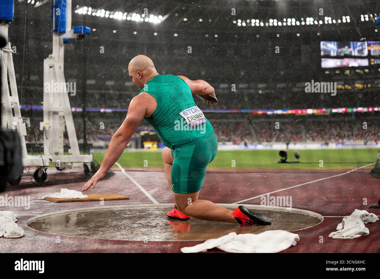 Australia's Matthew Denny slips and falls on the wet ground as rain ...