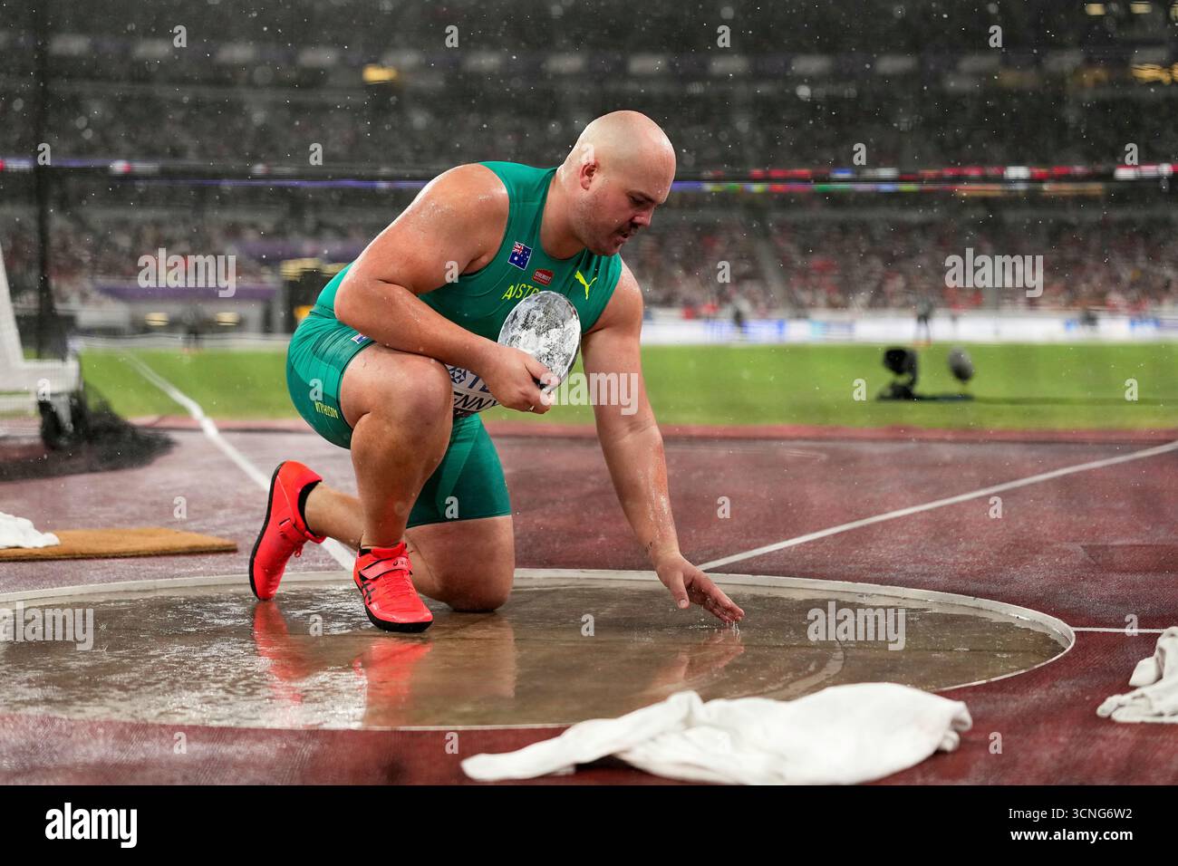 Australia's Matthew Denny gets up after slipping and falling on the wet ...