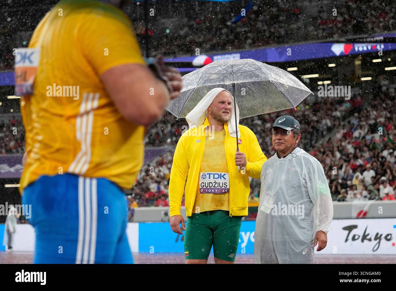 Lithuania's Andrius Gudzius and Sweden's Daniel Stahl, left, shelter ...