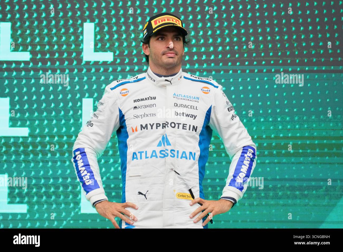 Third-placed Williams driver Carlos Sainz of Spain stands on the podium ...