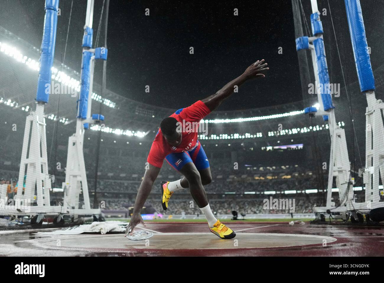 Cuba's Mario Alberto Diaz slips during the men's discus throw final at ...