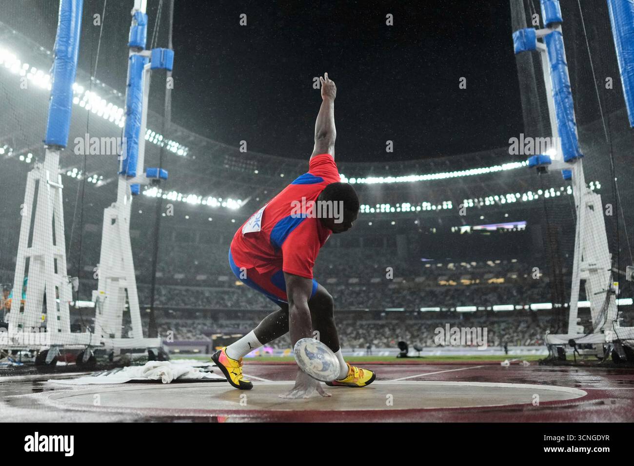 Cuba's Mario Alberto Diaz slips during the men's discus throw final at ...