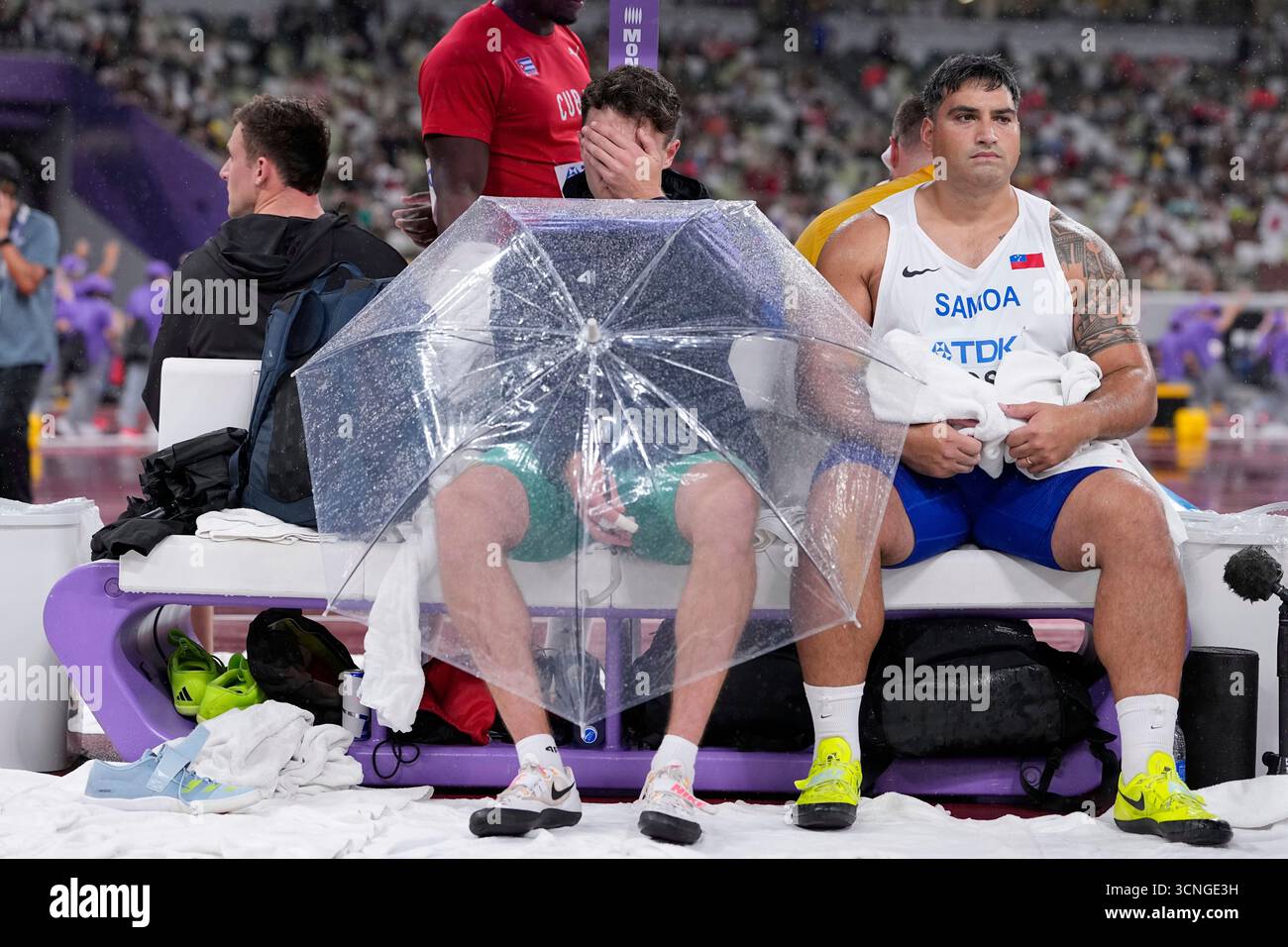 Lithuania's Martynas Alekna, left, and Samoa's Alex Rose wait to ...