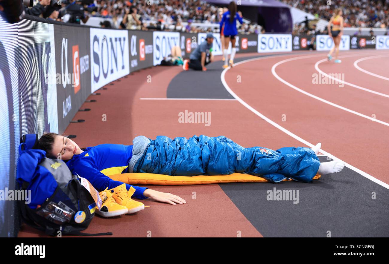 Yaroslava MAHUCHIKH of Ukraine lies down with her eyes closed in the ...