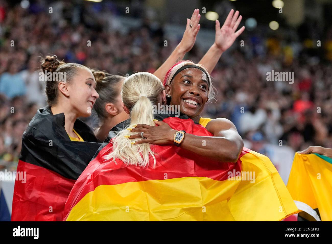 Jamaica's Shelly-Ann Fraser-Pryce embraces German team runners after ...