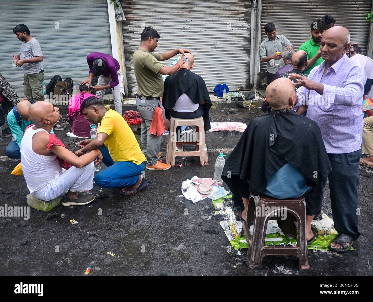 Mumbai,India,21st September of 2025= Hindu devotees clean their heads ...