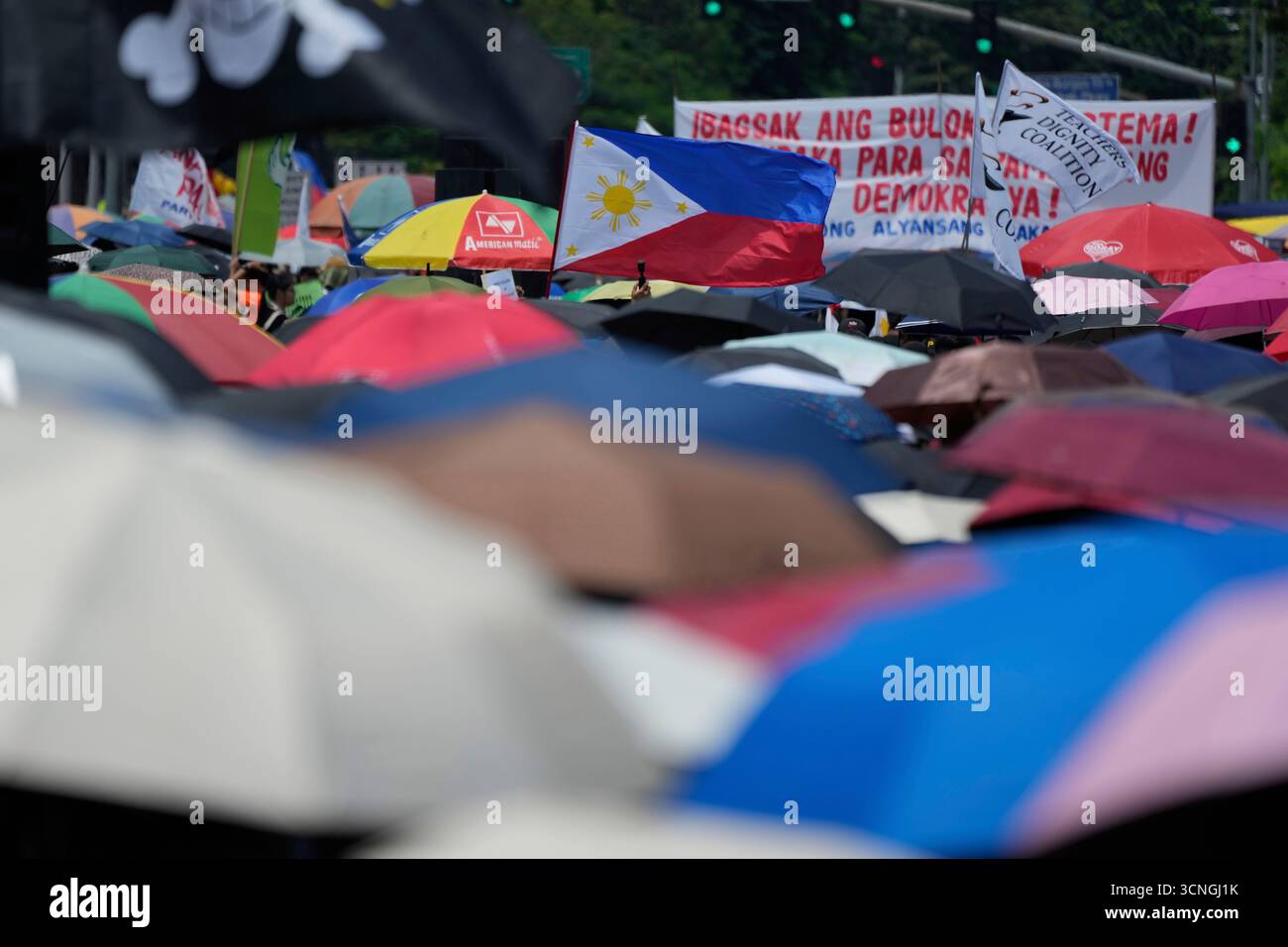 A Philippine flag is waved by protesters attending an anti-corruption ...