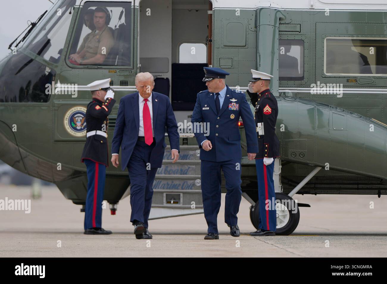 President Donald Trump, left, with Col. Christopher Robinson, right ...