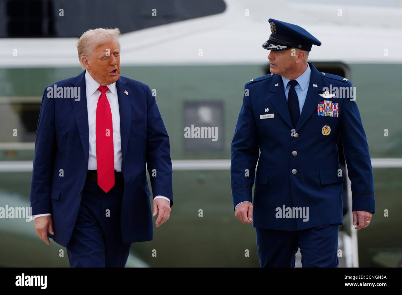 President Donald Trump, left, with Col. Christopher Robinson, right ...