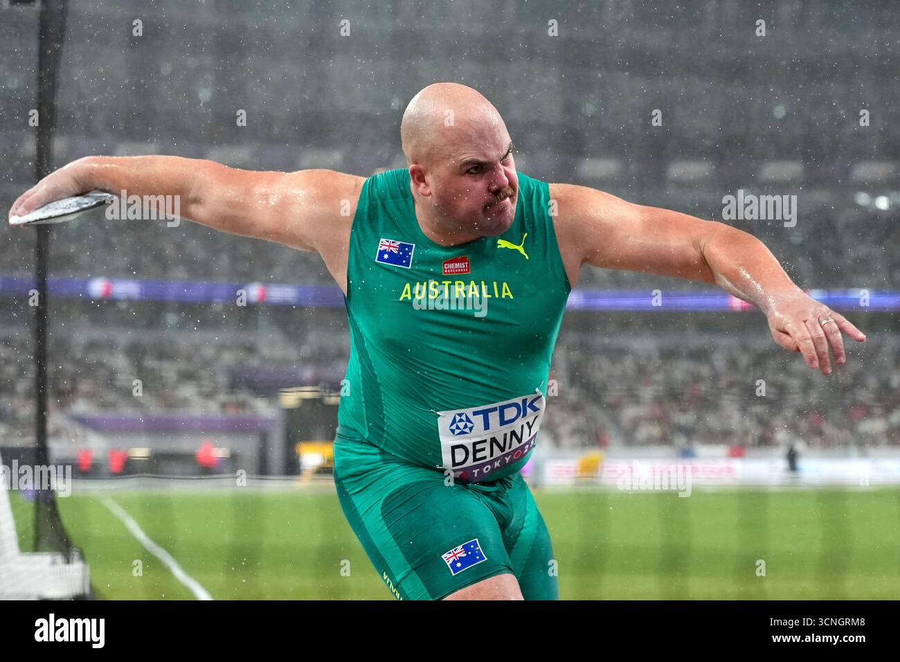 Australia's Matthew Denny makes an attempt under falling rain during ...