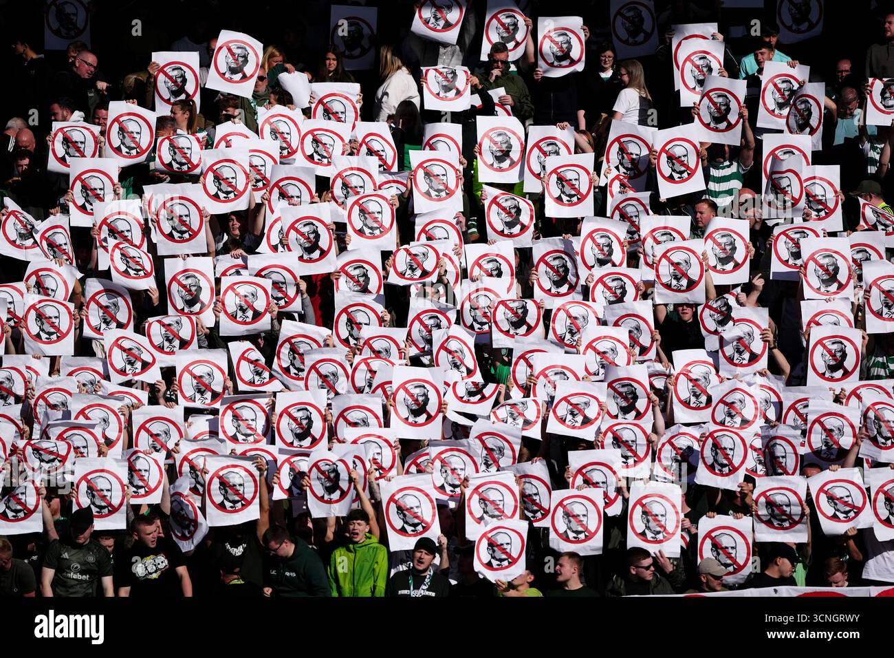 Celtic fans hold banners in protest of Celtic board members Peter ...